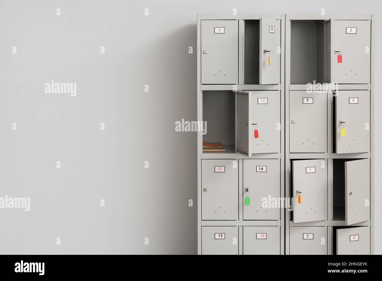 Modern locker near light wall Stock Photo - Alamy