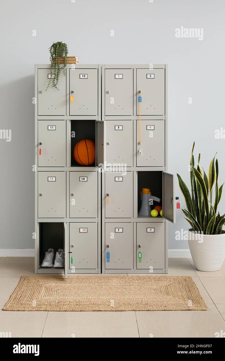 Locker with sport equipment in change-room Stock Photo - Alamy