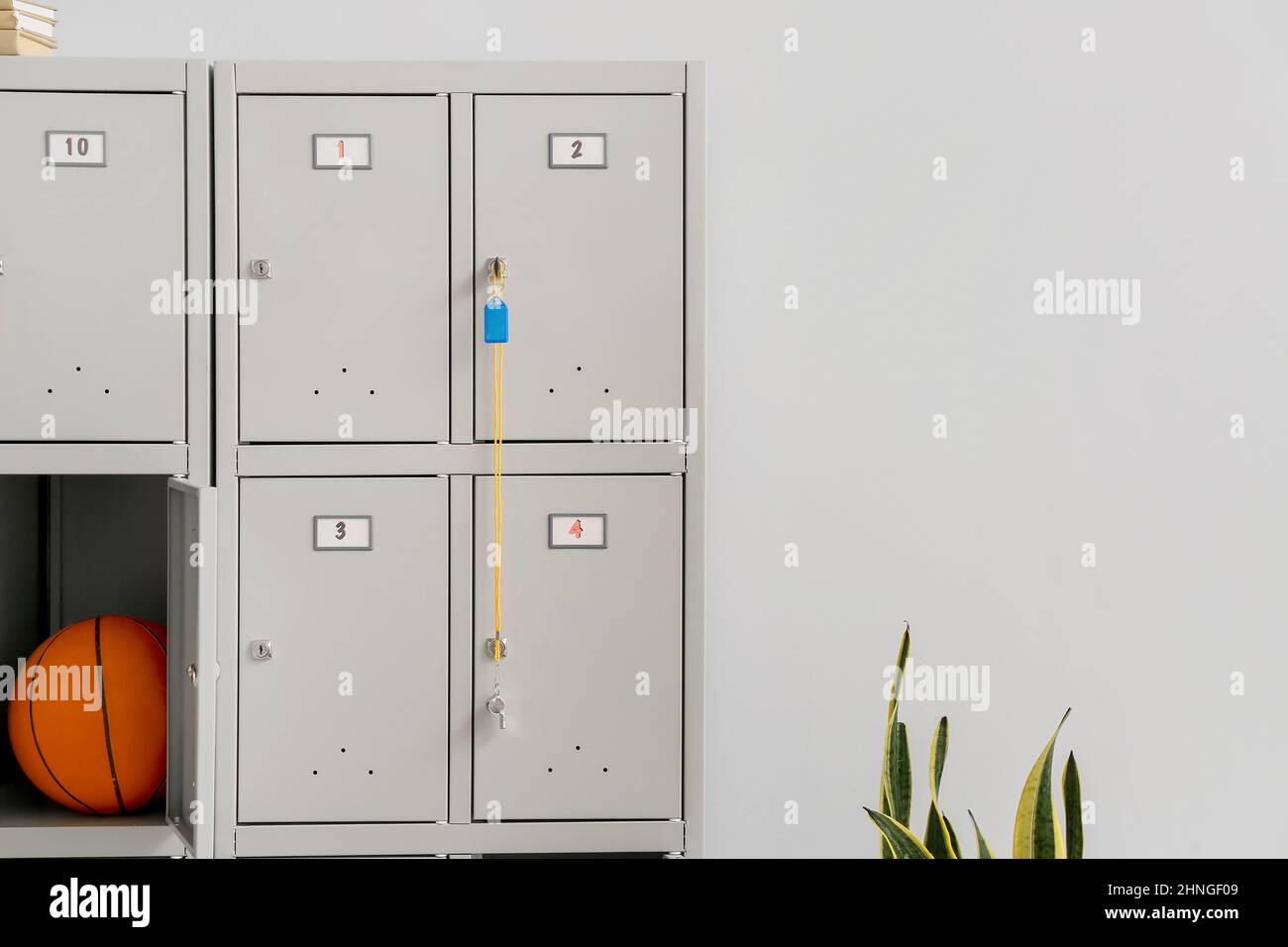 Locker with sport equipment in change-room Stock Photo - Alamy