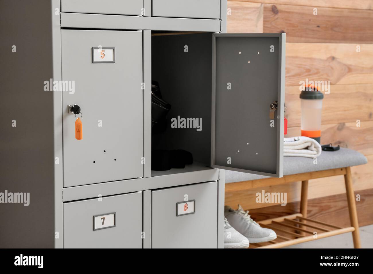 Locker with sport equipment in change-room Stock Photo - Alamy
