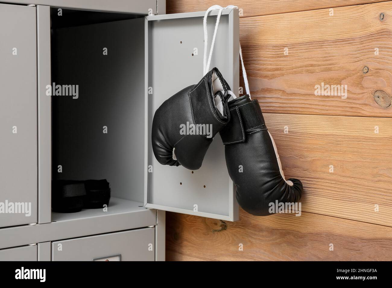 Locker with boxing gloves in change-room Stock Photo - Alamy