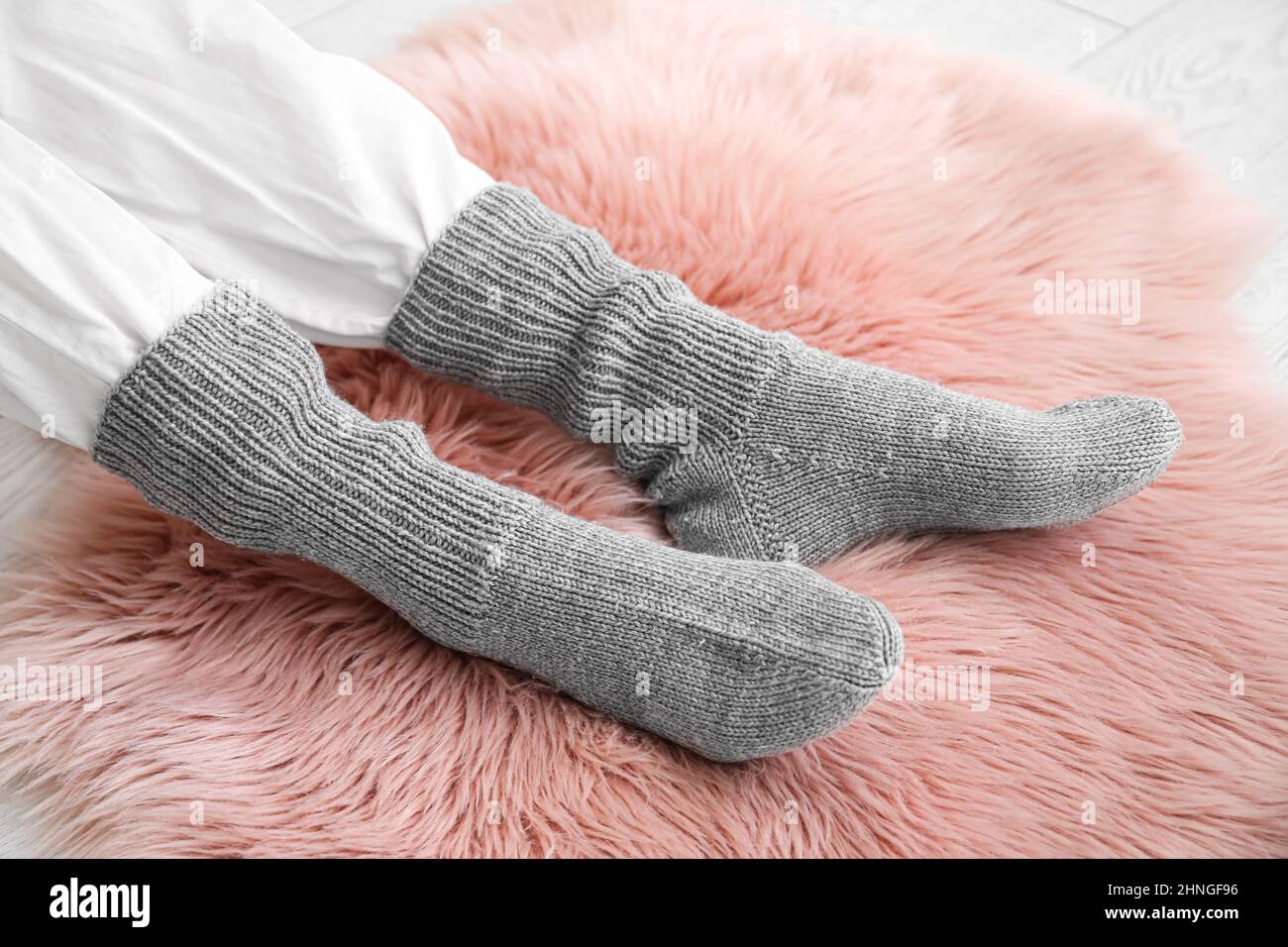 Female legs in warm socks hi-res stock photography and images - Alamy