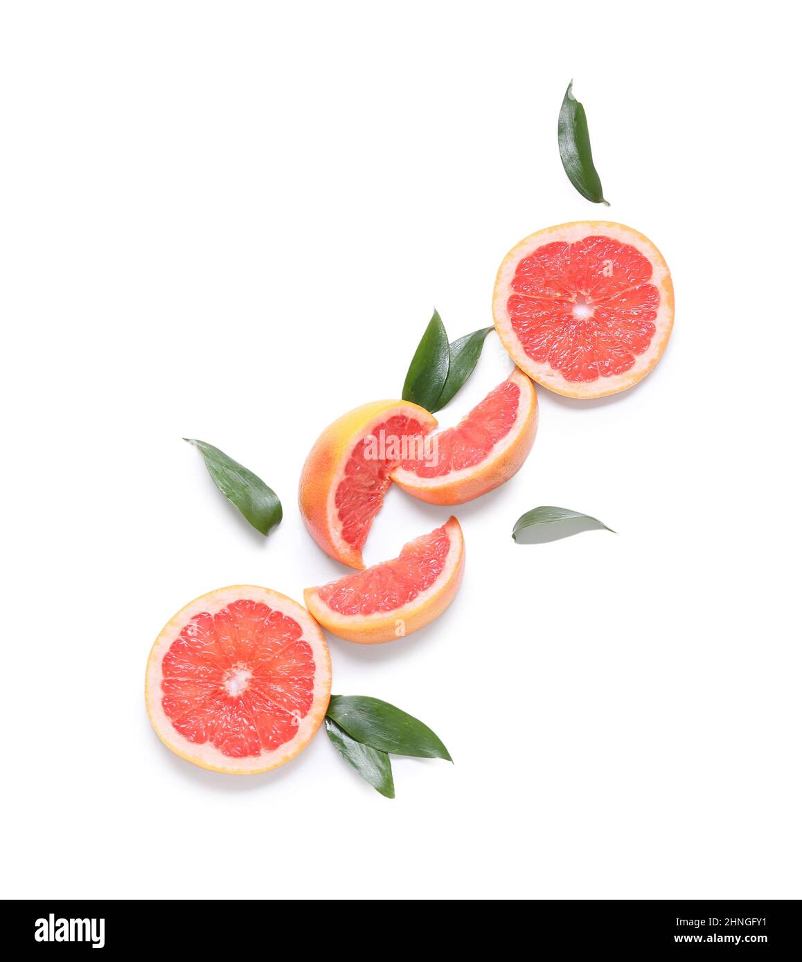 Fresh grapefruit pieces on white background Stock Photo - Alamy