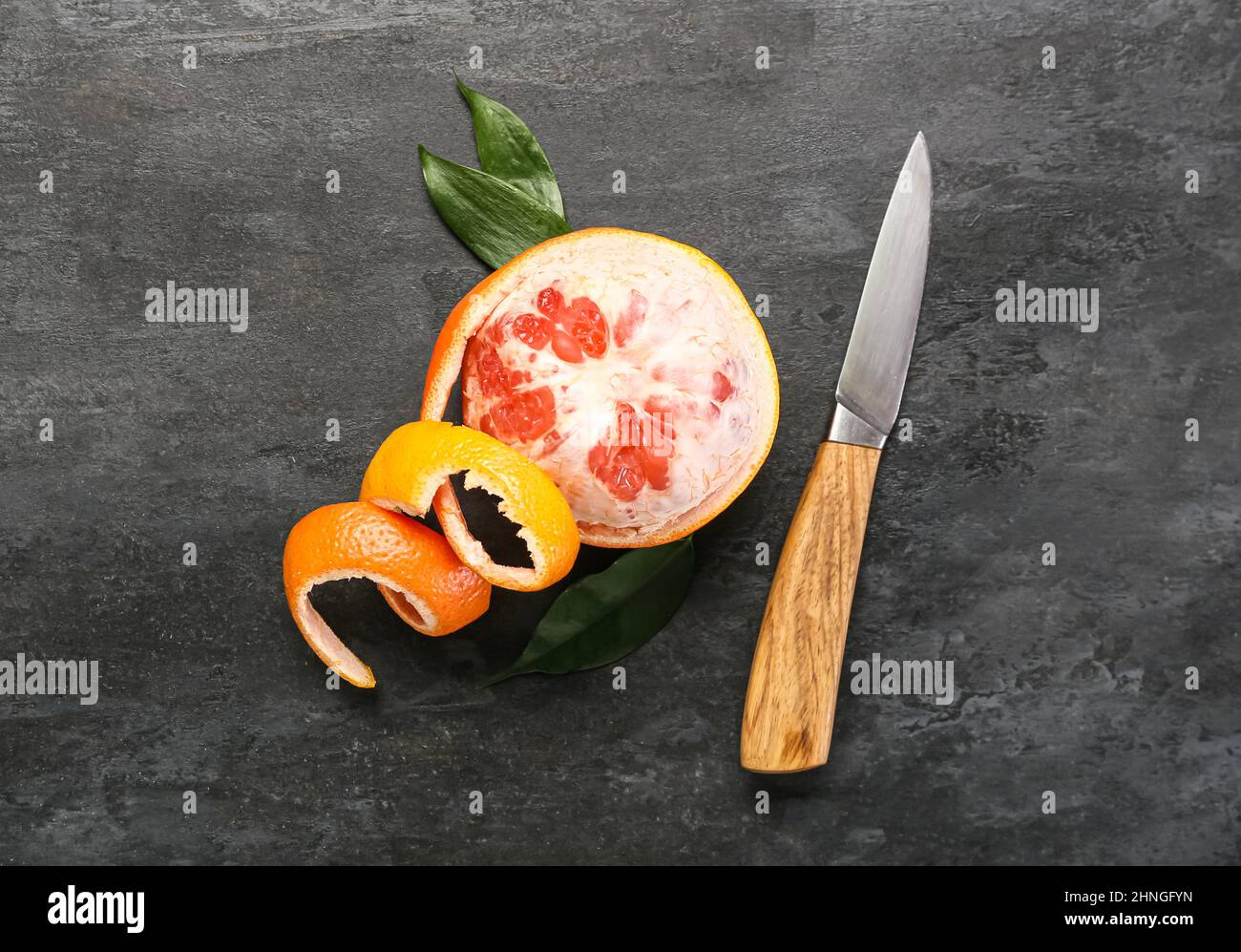 Fresh peeled grapefruit on dark background Stock Photo - Alamy
