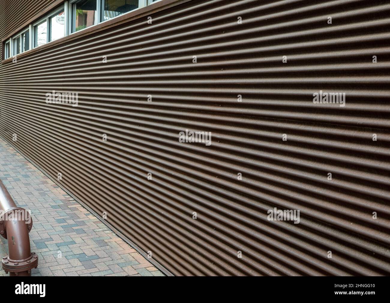 Building exterior wall facade with horizontal lines for texture with ...