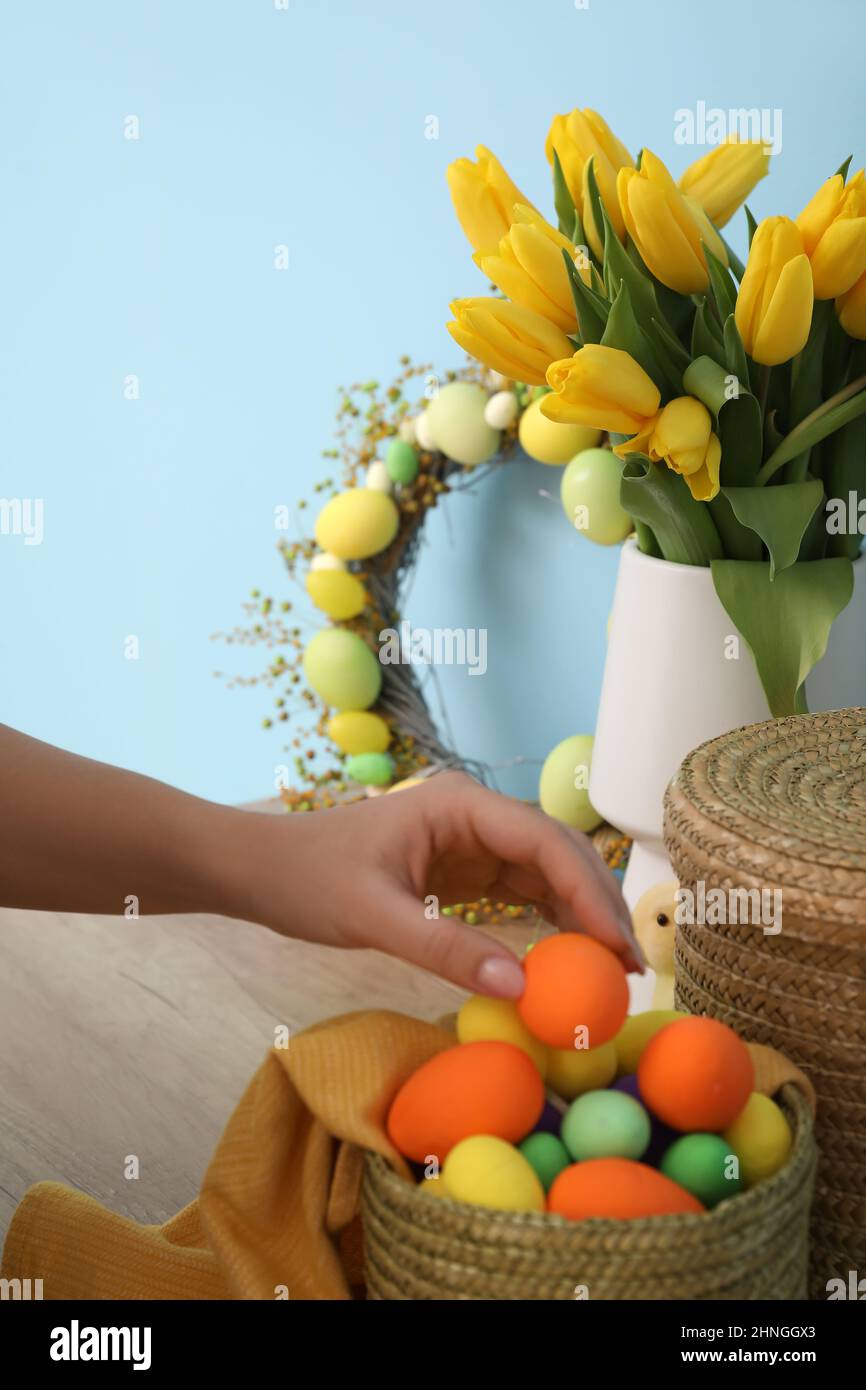 Woman putting painted easter eggs hi-res stock photography and images ...