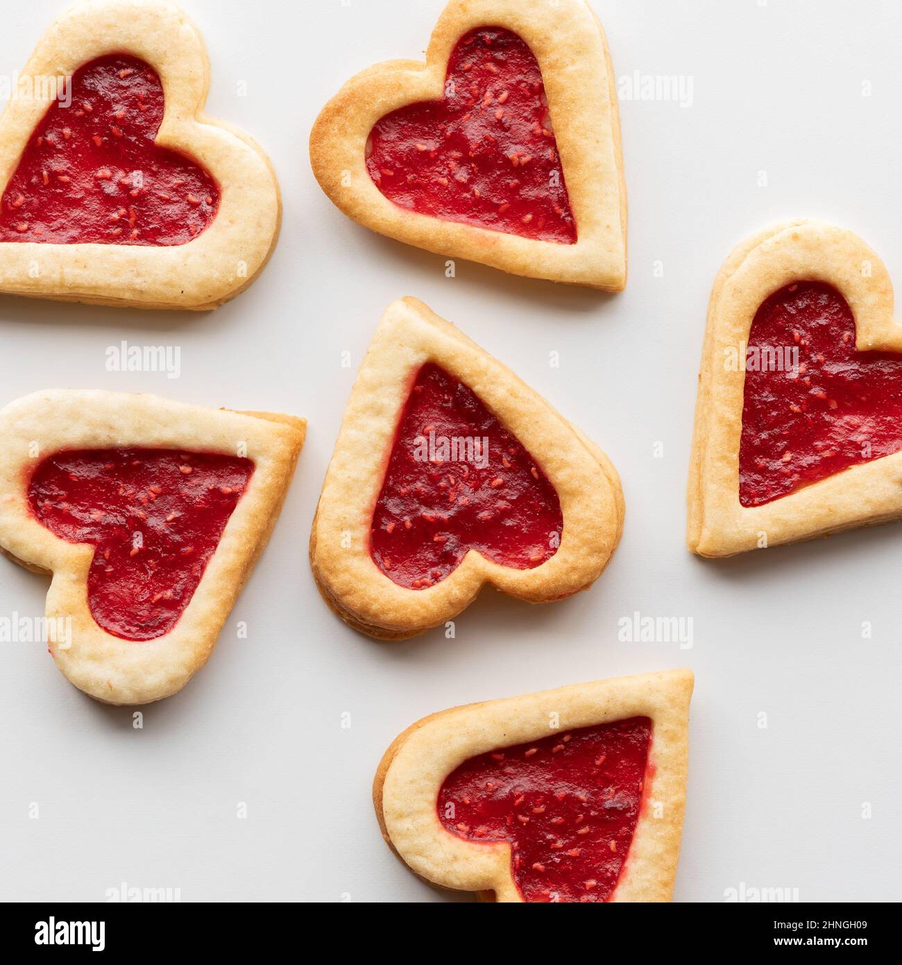 Top down view of heart shaped raspberry filled Linzer cookies Stock ...