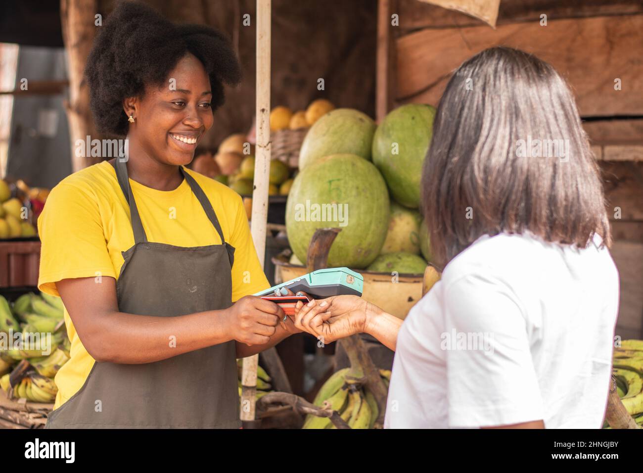Black person using pos hi-res stock photography and images - Alamy