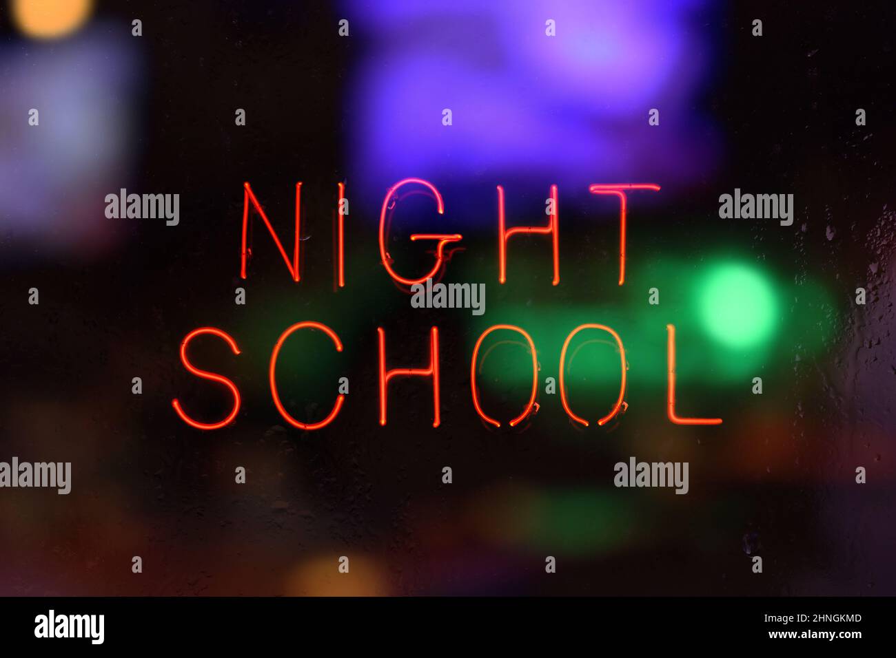 Vintage Night School Neon Sign in Rainy Window Stock Photo - Alamy