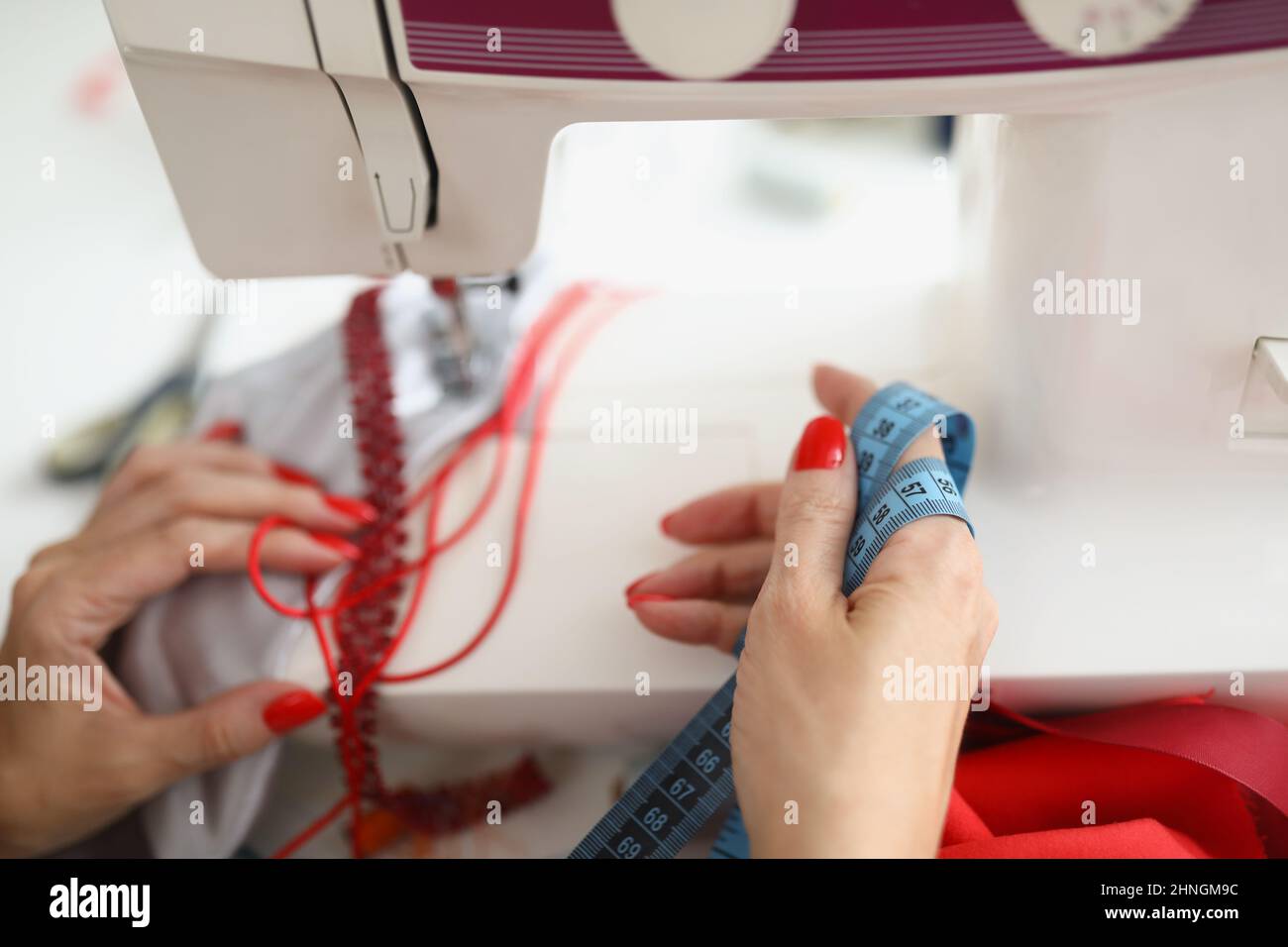 Tailor modeling hi-res stock photography and images - Alamy