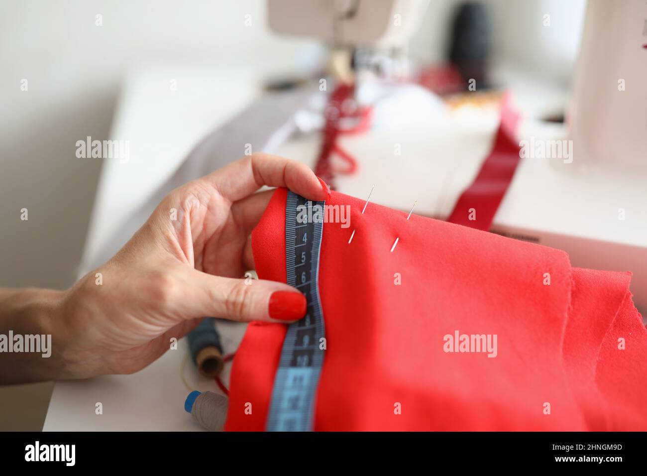 Female hands hold cloth and measuring tape Stock Photo - Alamy