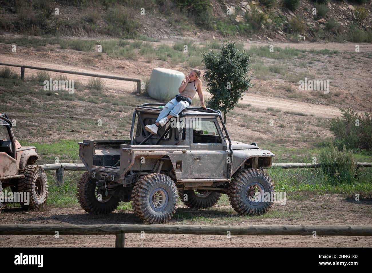 Young girl sitting on top of a modified Land Rover Defender Stock Photo ...