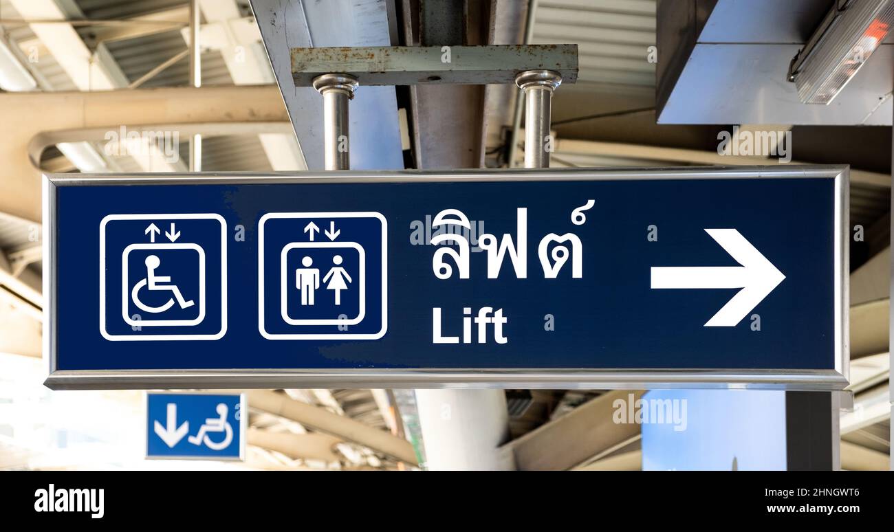 Sign in English and Thai languages at a train platform on the Bangkok ...
