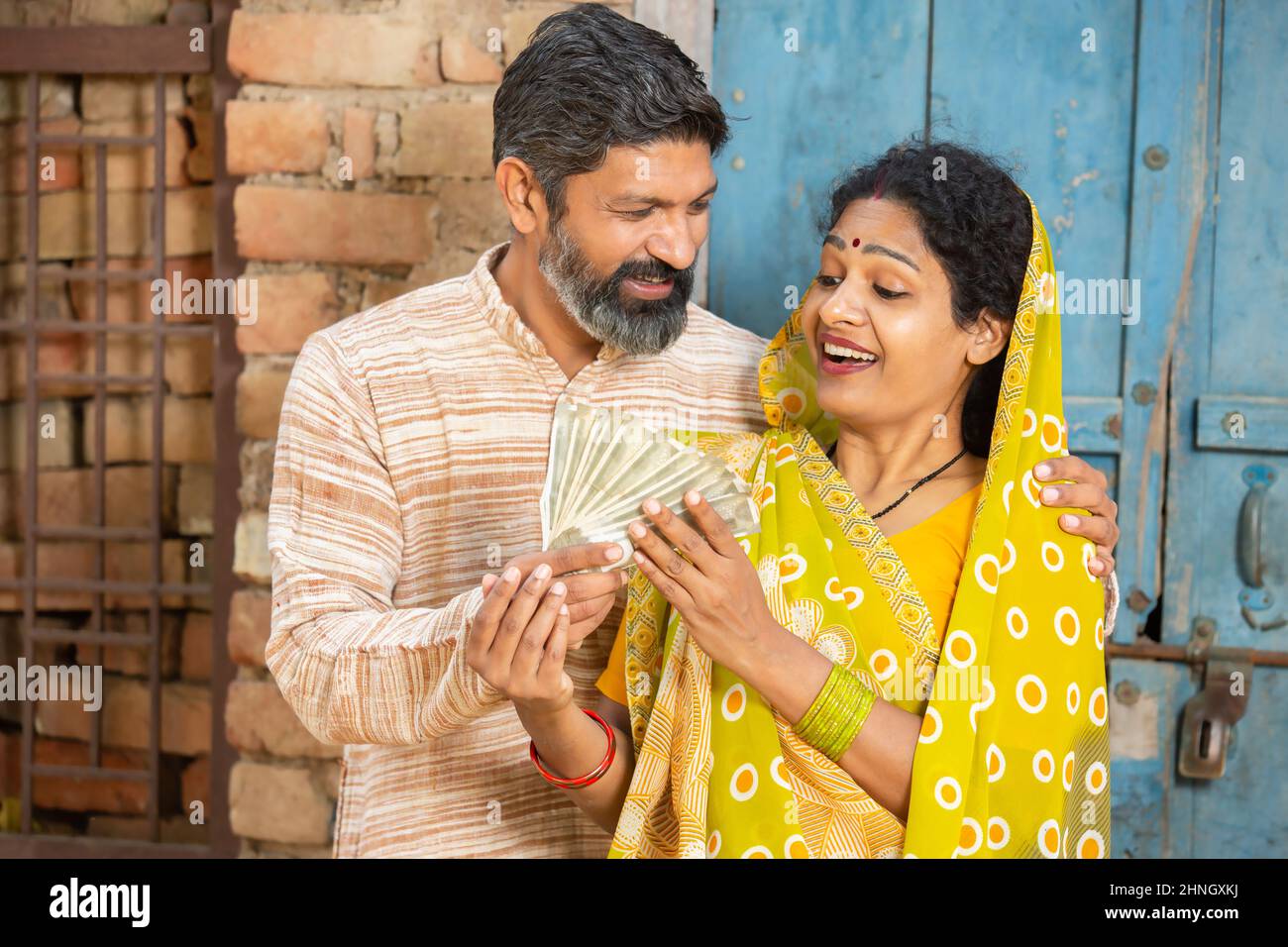Happy rural couple holding indian rupees notes, Smiling Beard man give ...
