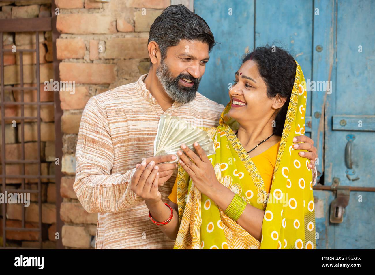 Happy rural couple holding indian rupees notes, Smiling Beard man give ...