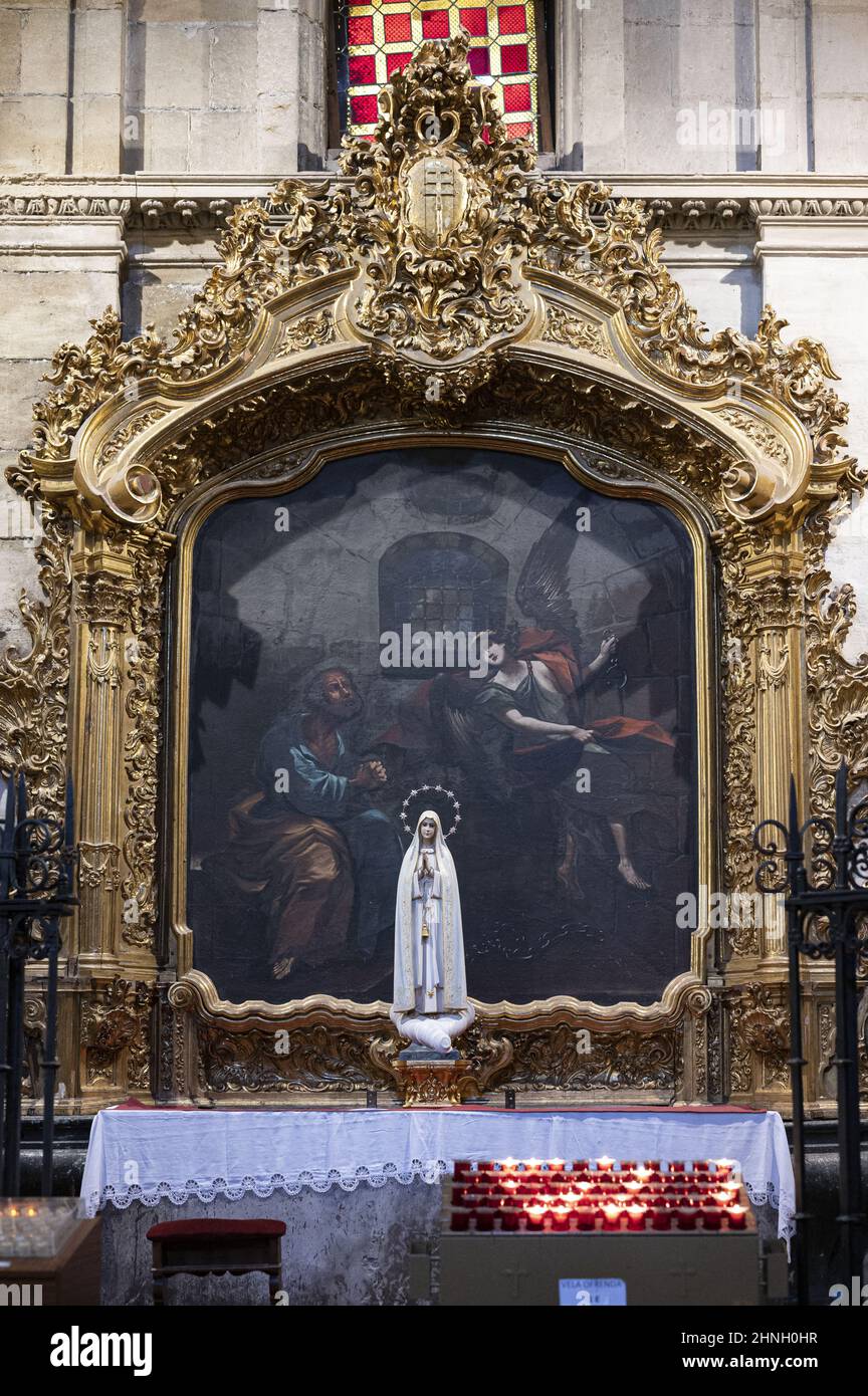 Inside a Spanish church, an altar with a painting and candles Stock ...