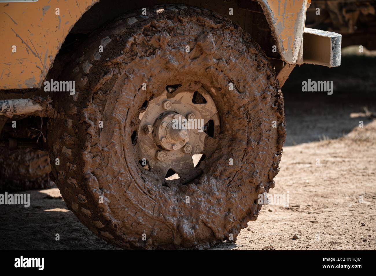 Dirty wheel of an all-terrain car full of mud Stock Photo - Alamy