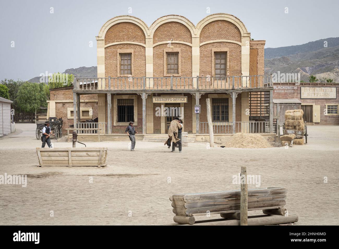 Wild west movie set with men fighting Stock Photo - Alamy