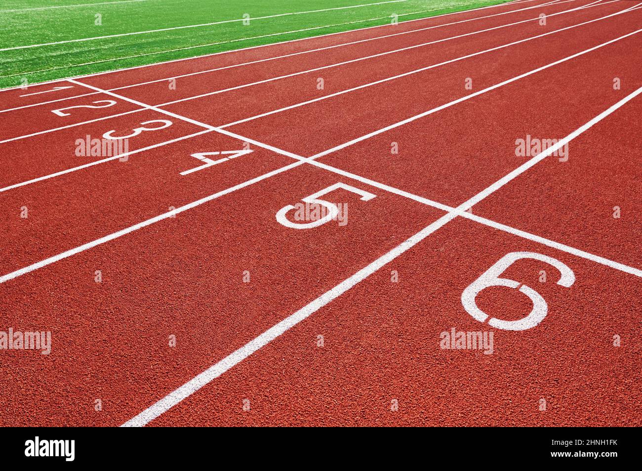 Red runninng race track with lane numbers closeup, Treadmill at stadium ...