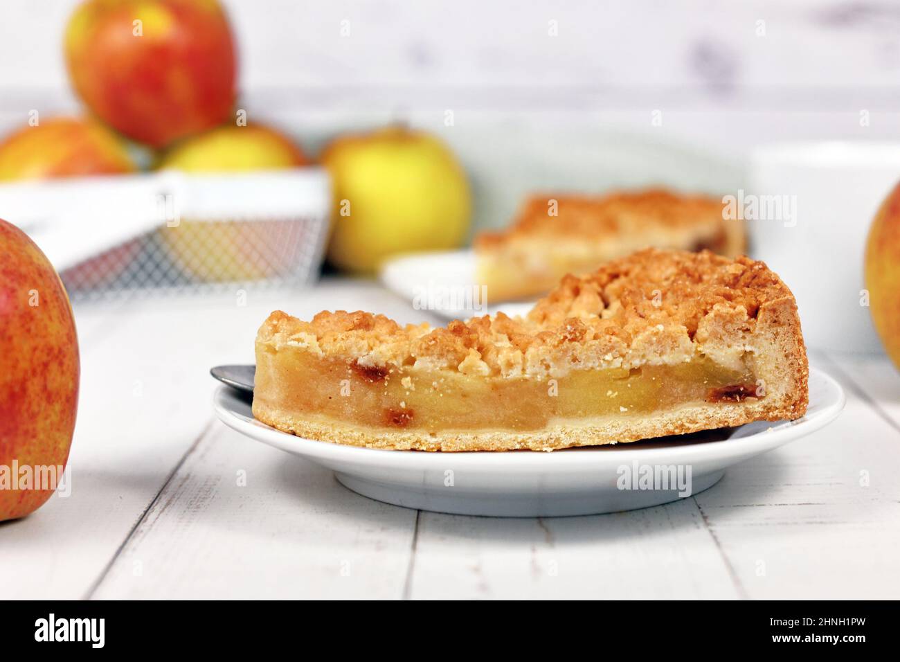 Side view of slice of traditional European apple pie with topping ...