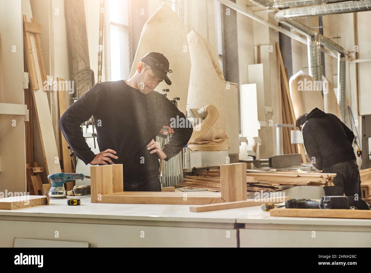 Expert sawdust maker. Portrait of worker doing his job with the wood ...
