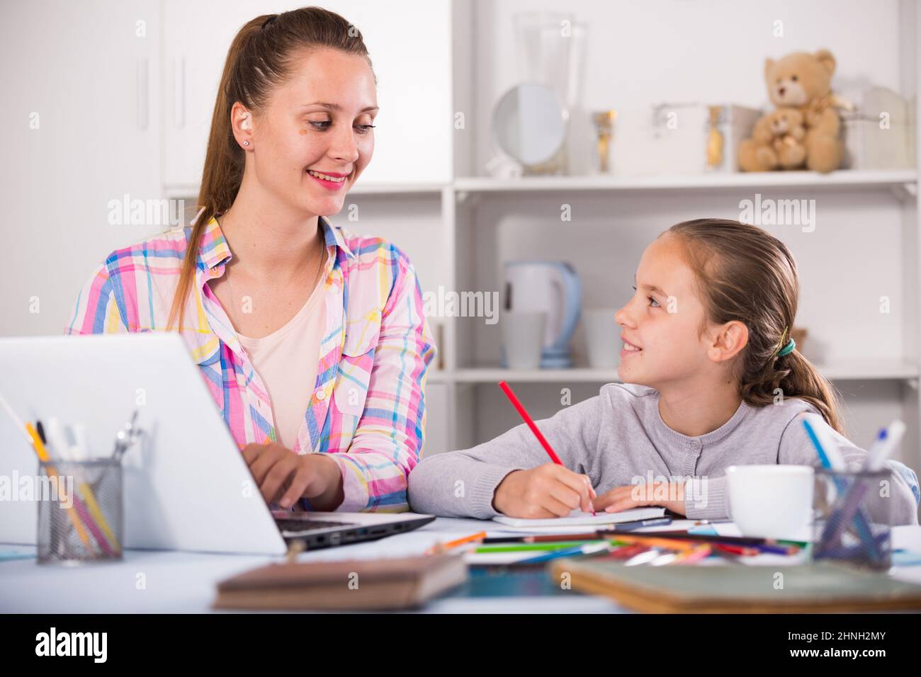 mother and daughter doing homework Stock Photo - Alamy