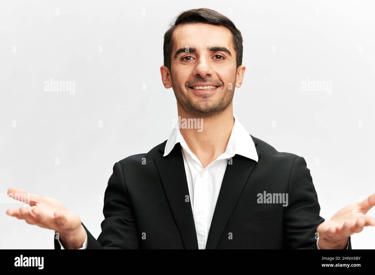 a man in a black business suit shrug Marketing Manager successful look ...