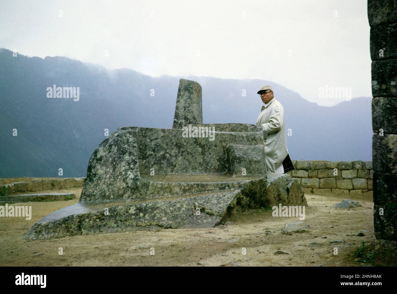 Male tourist at Intihuatana sundial Stone, Machu Picchu, Peru, Machu ...