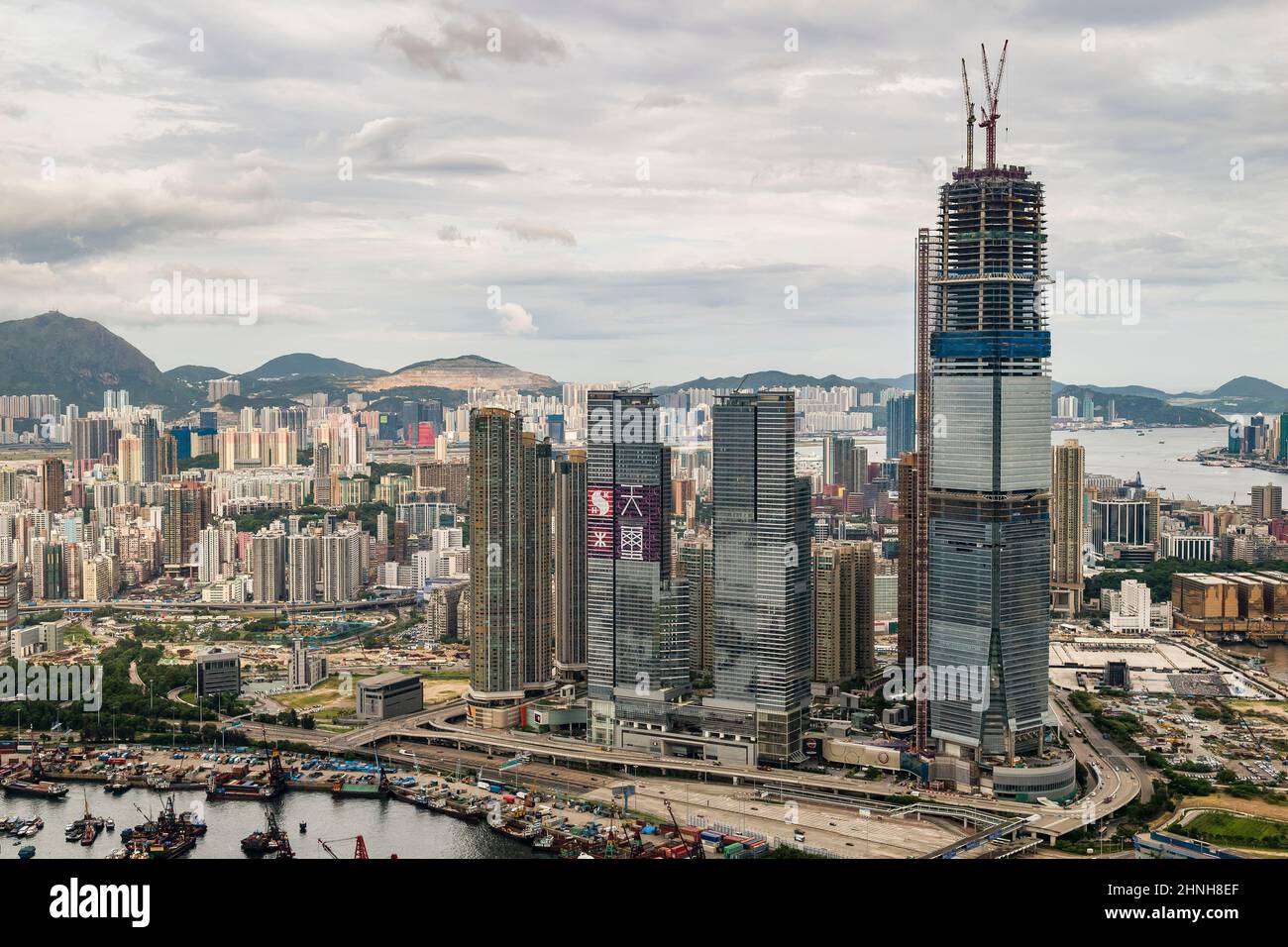 Aerial from helicopter showing Union Square, West Kowloon, Hong Kong ...
