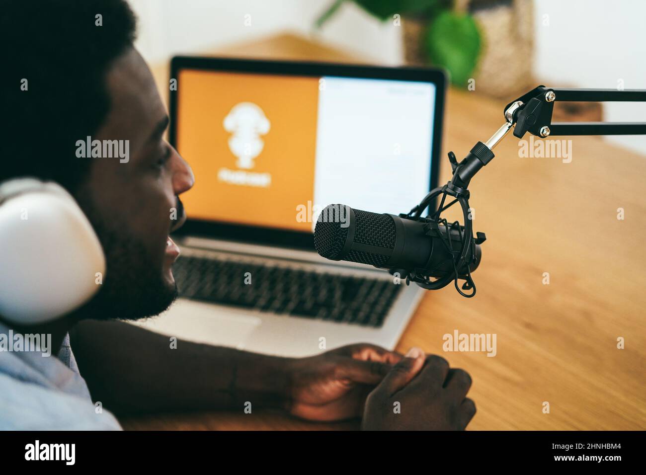 African man live streaming podcast session at home studio - Focus on ...