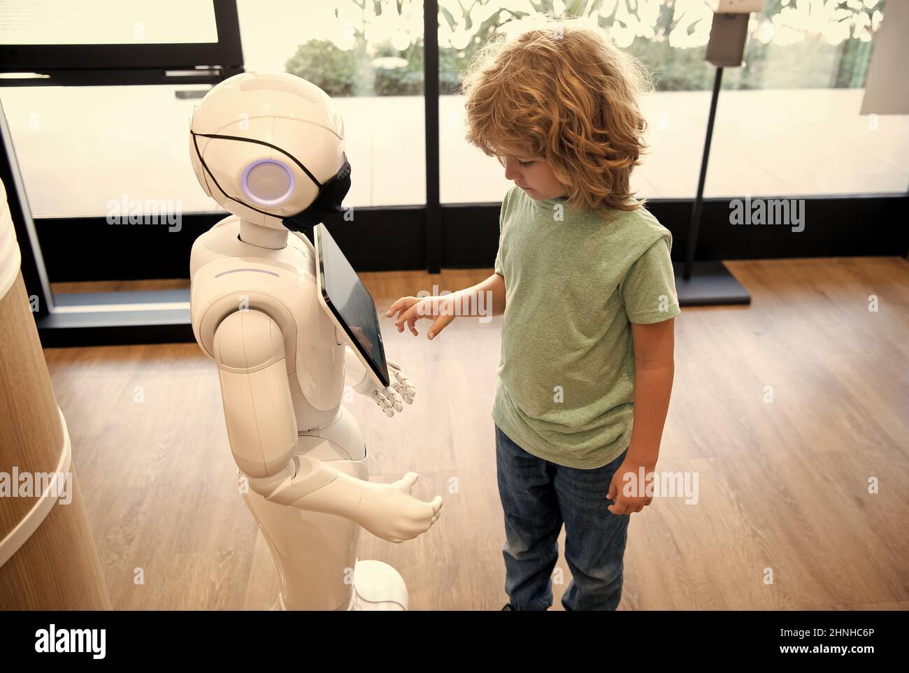 robot provide assistance to child. automation. artificial intelligence ...