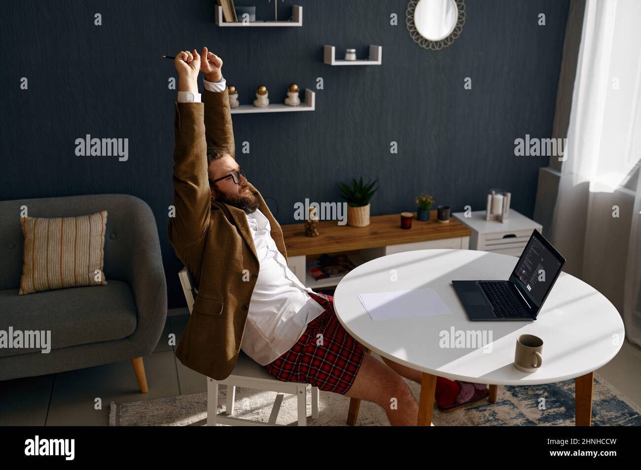 Tired nerd working online from home office Stock Photo - Alamy