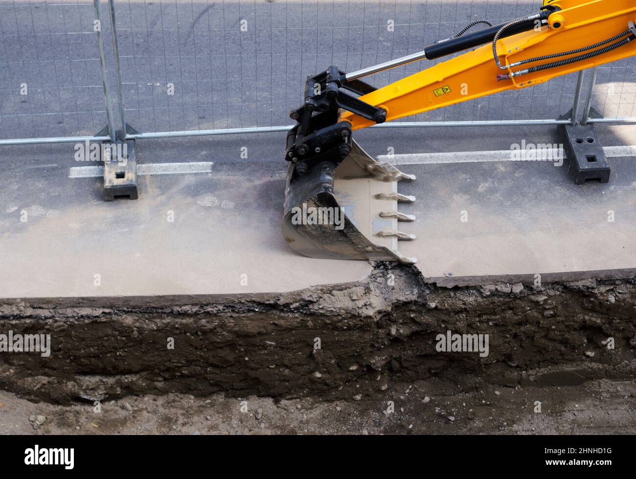 excavator and excavated road Stock Photo - Alamy