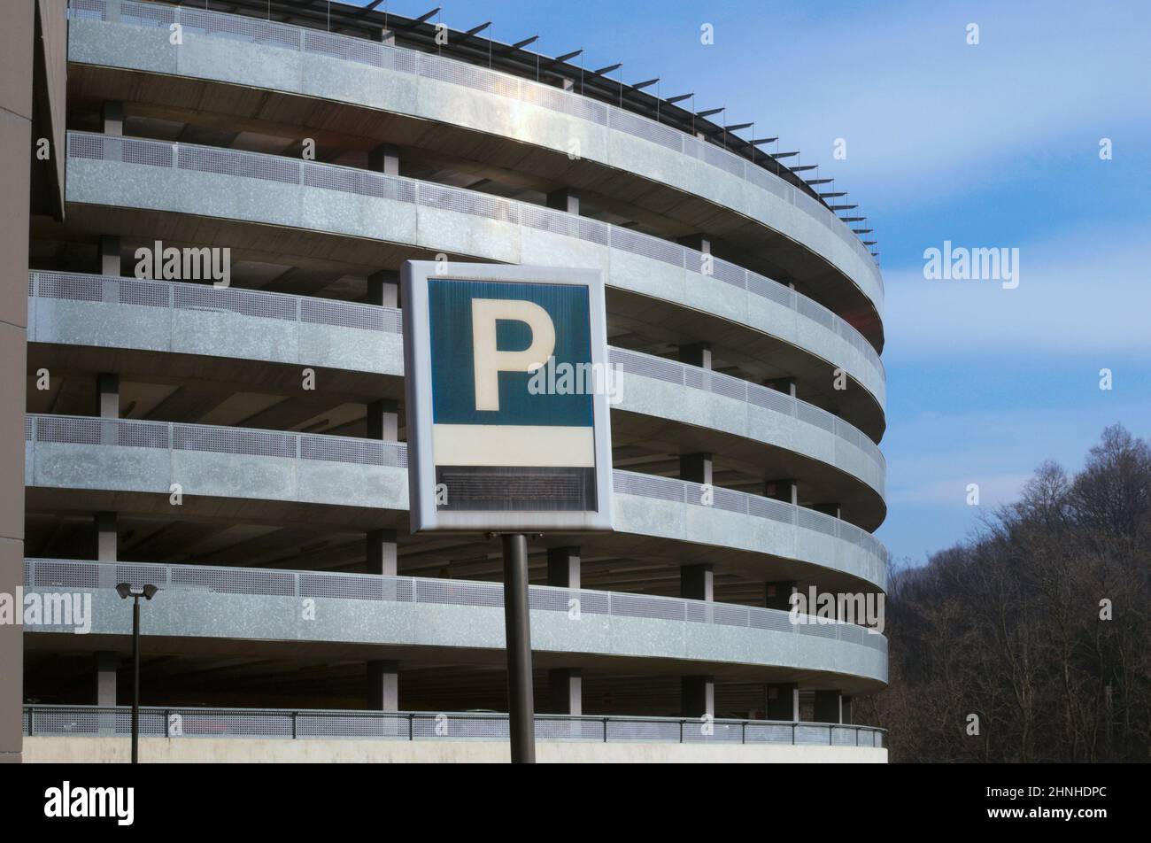 Parking sign and Multi-level Parking Garage with metal railing Stock ...