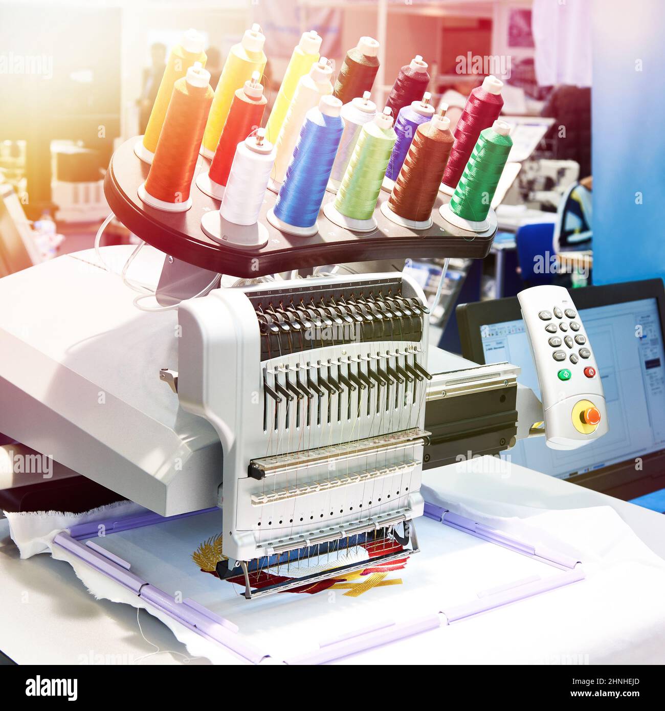 Embroidery industrial machine in sewing workshop Stock Photo - Alamy