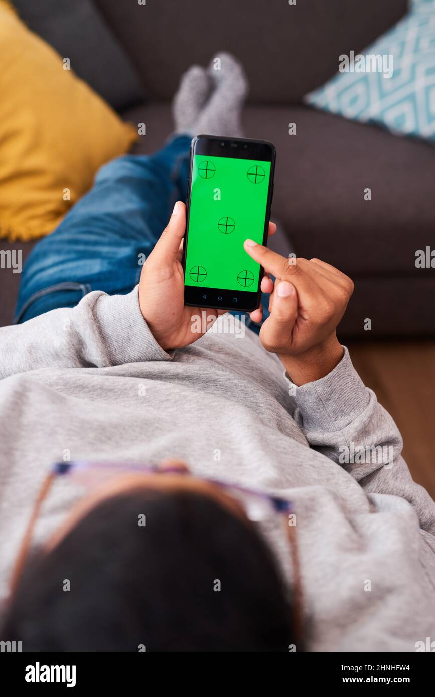 Man scrolling smartphone green screen hi-res stock photography and ...