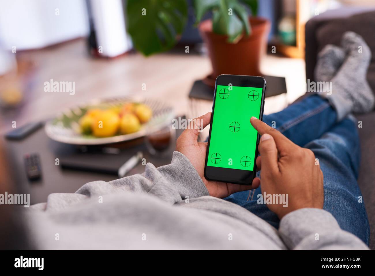 Man scrolling phone green screen hi-res stock photography and images - Alamy