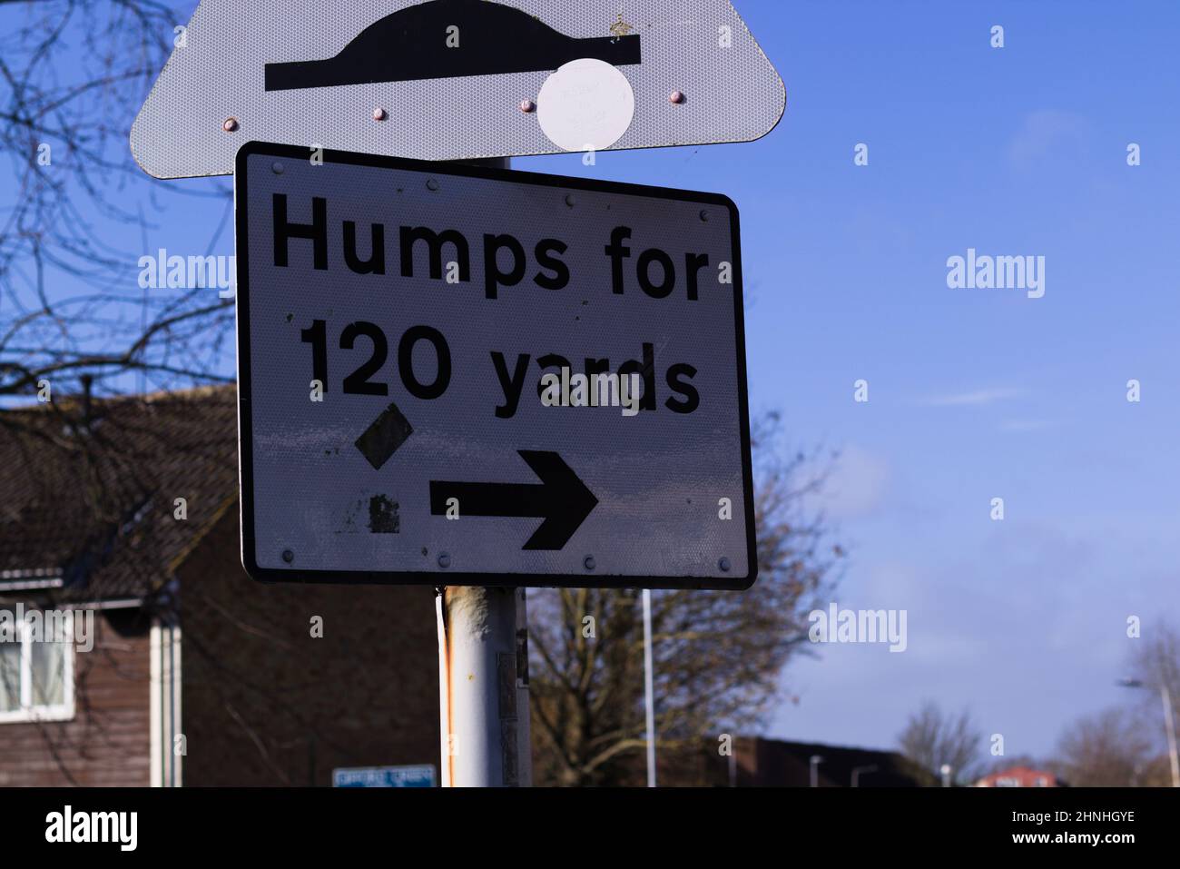 Motoring - Road Sign of Humps in road for 120 Yards Stock Photo - Alamy
