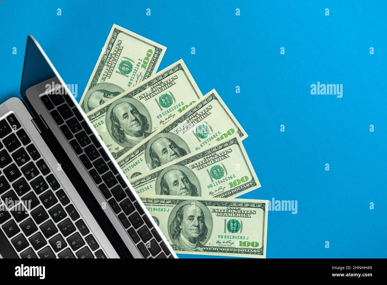 Laptop keyboard with money. Freelance concept, making money at home ...