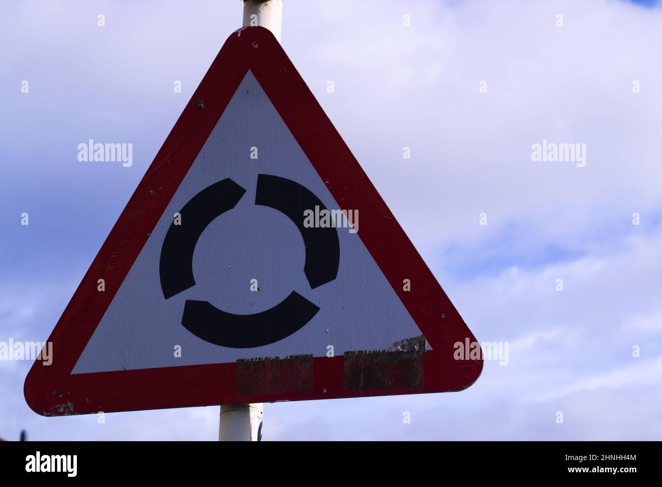 Close-up of a Roundabout / Road Traffic Sign Stock Photo - Alamy