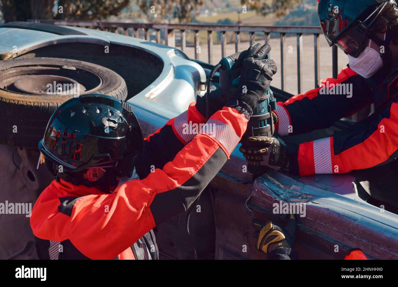 Firefighter cutting a crashed car to repair it Stock Photo - Alamy