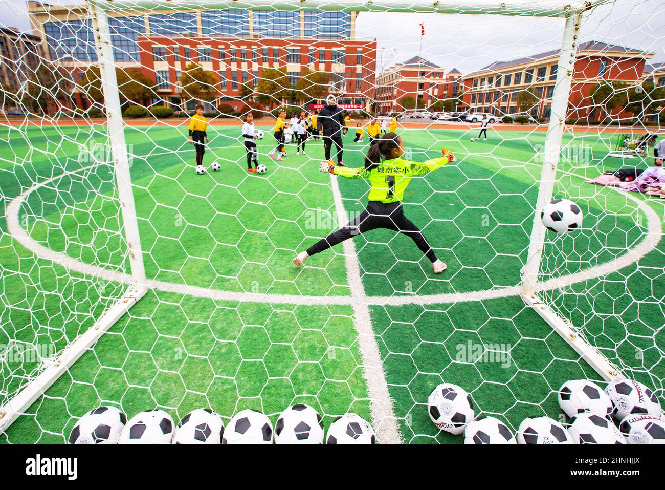 HAI'AN, CHINA - FEBRUARY 17, 2022 - Children of a girls' soccer club at ...
