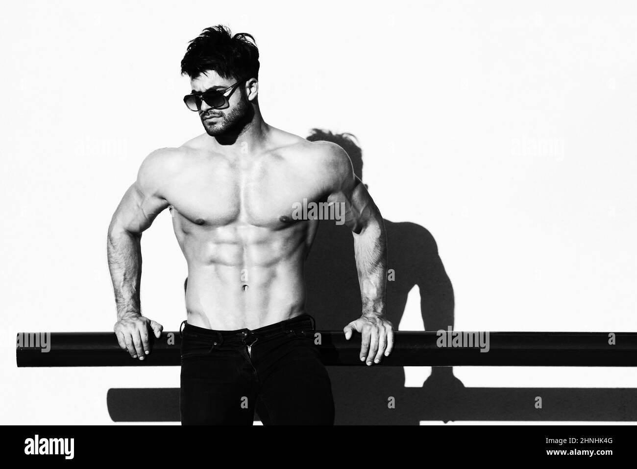 Portrait of Model Man Standing Near the Wall Stock Photo - Alamy