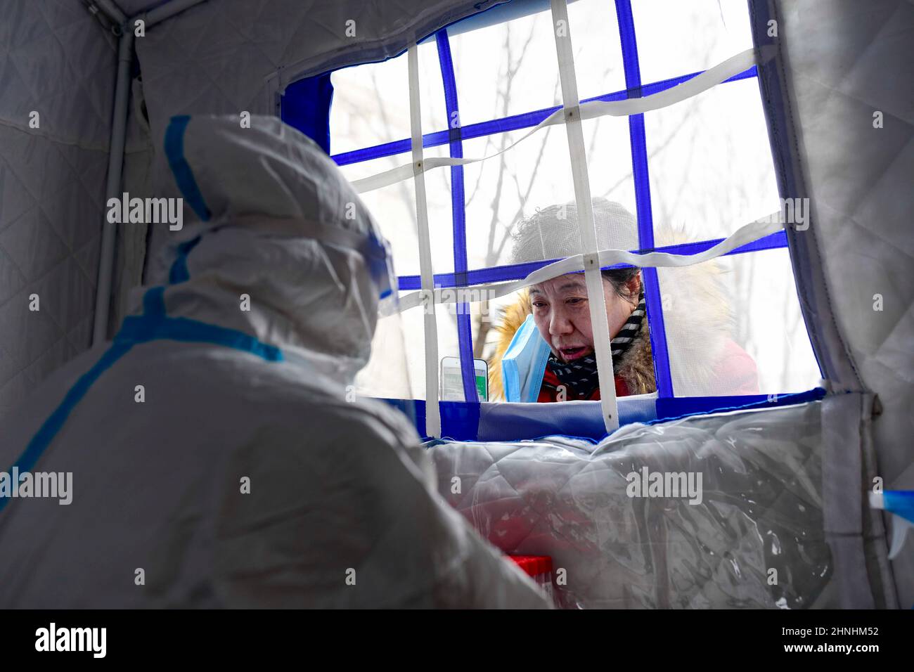 HOHHOT, CHINA - FEBRUARY 17, 2022 - Medical staff take nucleic acid ...