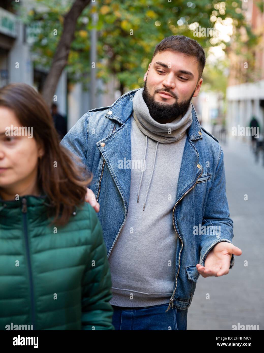 Man trying to pick up woman on street Stock Photo - Alamy