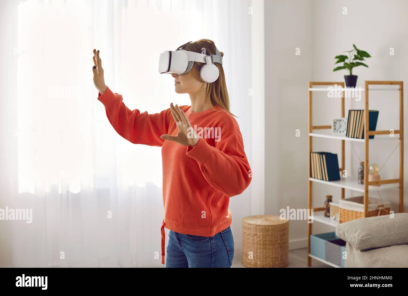 Woman wearing innovative virtual reality headset experiencing what ...