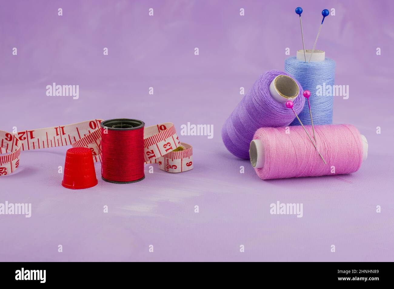 set of colouring threads on colourful background Stock Photo - Alamy