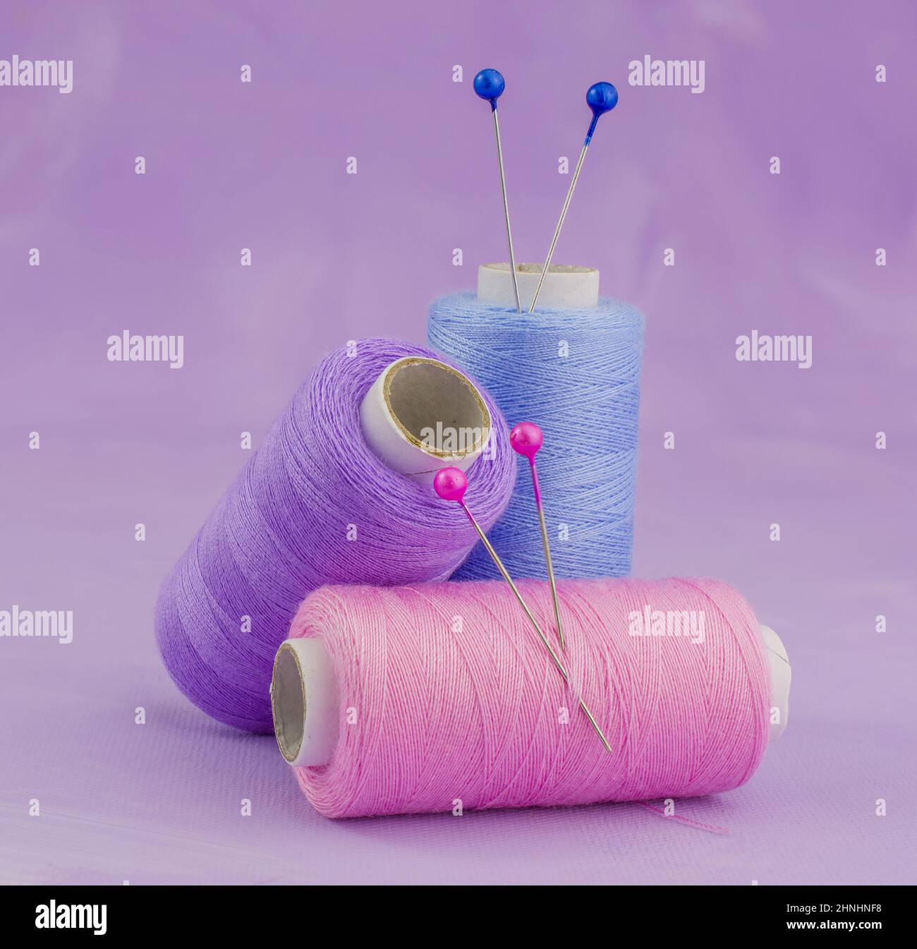 set of colouring threads on colourful background Stock Photo - Alamy