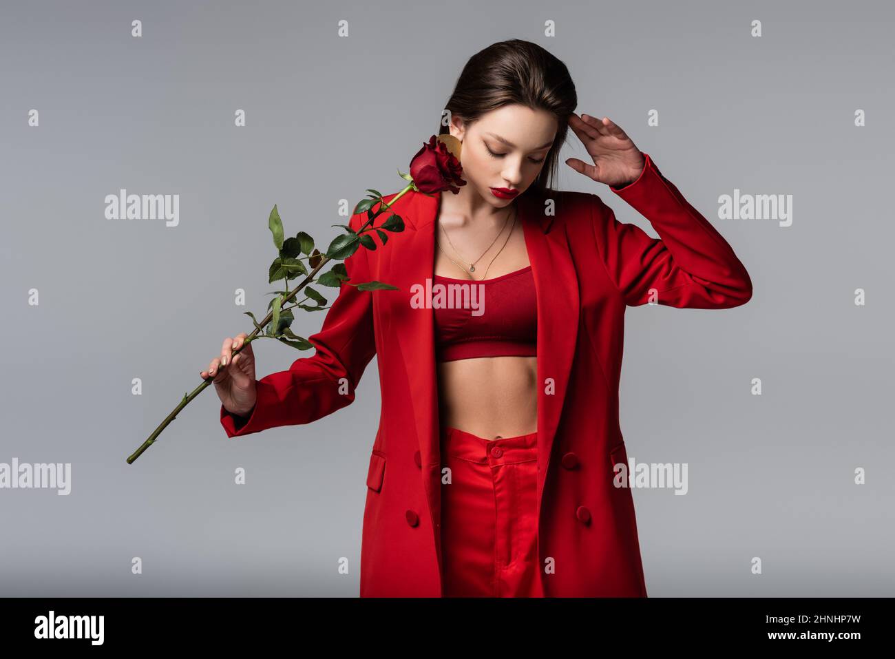Model in red suit hi-res stock photography and images - Alamy