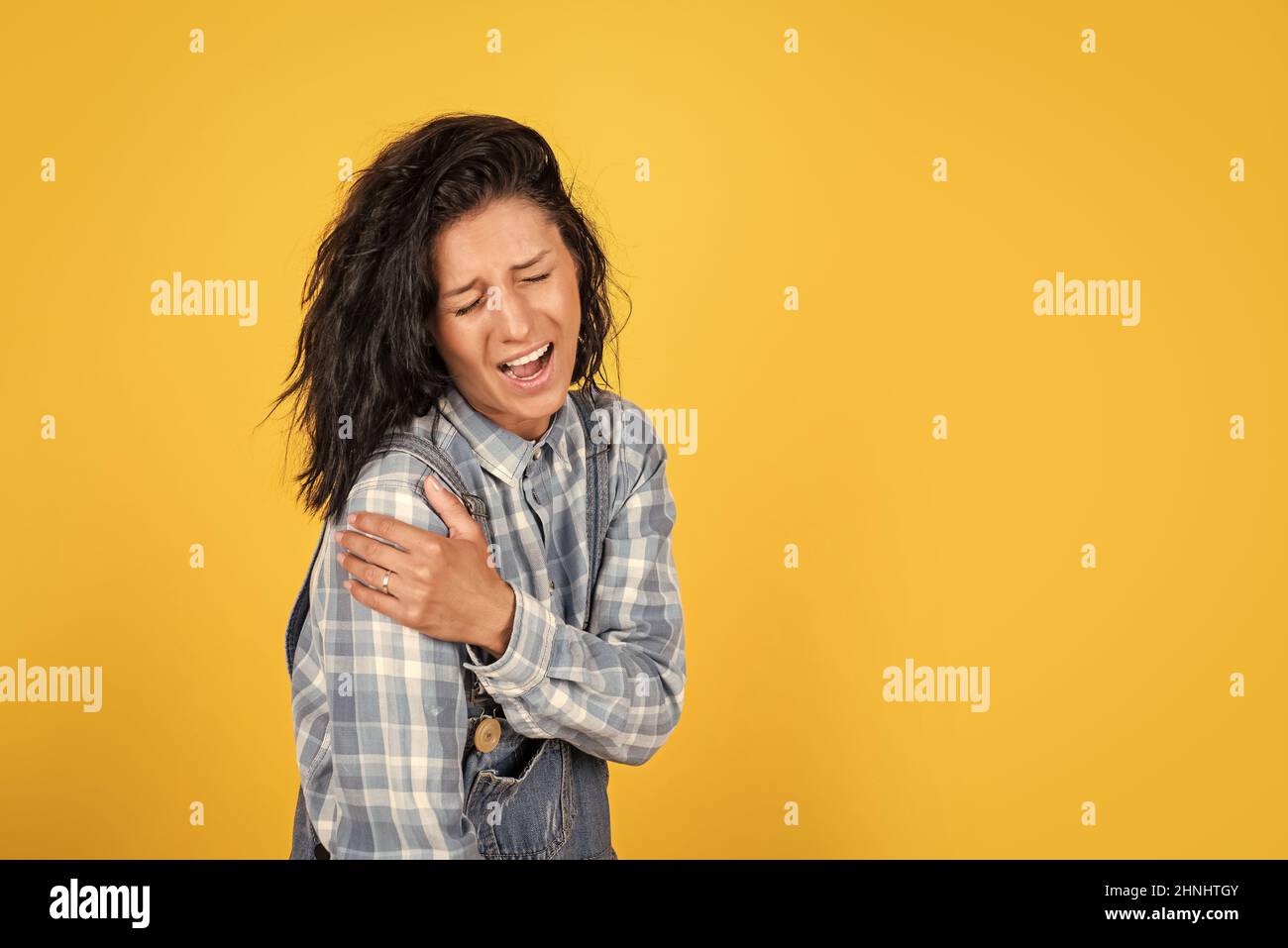 it hurts a lot. terrible pain. female has bruised shoulder. woman hit ...